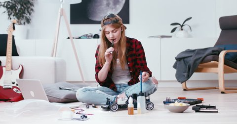 Young Attractive Teen Girl Assembling Toy Stock Footage Video (100% ...