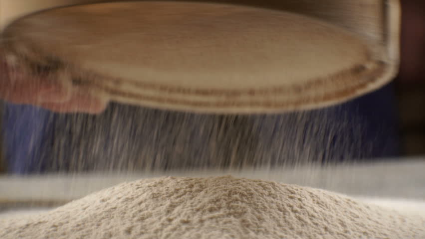 sifting whole-grain flour through sieve close-up Stock Footage Video ...