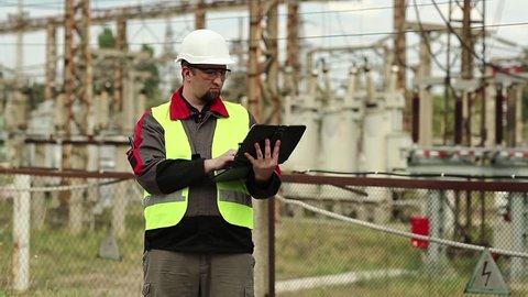 Powerman Tablet Pc On Power Plant Stock Footage Video (100% Royalty ...