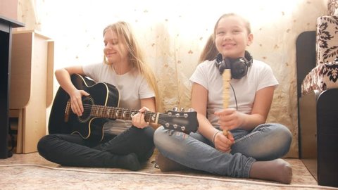 Two Female Teens Playing Musical Instruments Stock Footage Video (100% ...