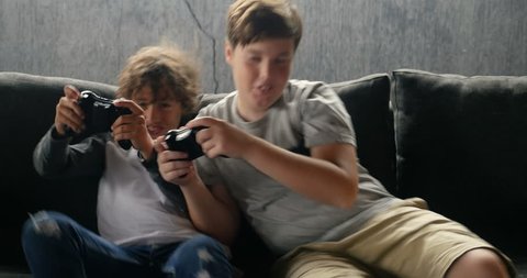 Two Young Boys Playing Video Games Stock Footage Video (100% Royalty ...