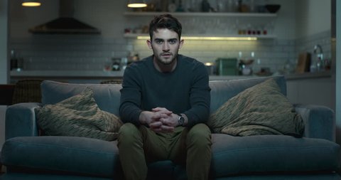 Young Man Sitting On Edge Couch Stock Footage Video (100% Royalty-free ...