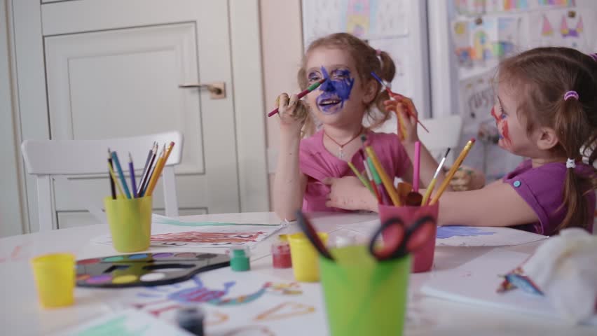 two girls paint each other's colors Stock Footage Video (100% Royalty ...