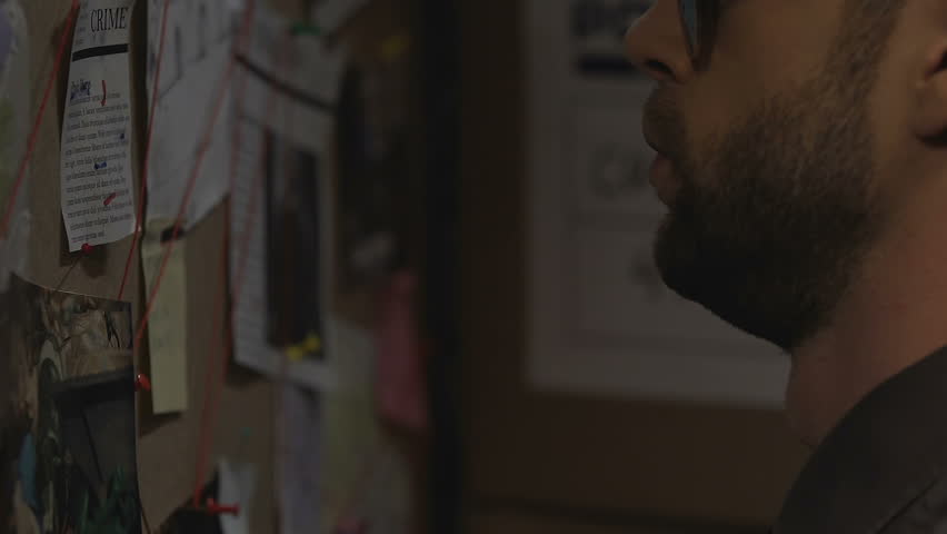 Detective Pins Newspaper Clipping On Stock Footage Video (100% Royalty ...