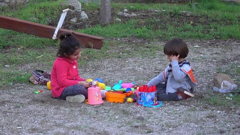 4k Zoom Out Children Playing Alone Stock Footage Video (100% Royalty ...