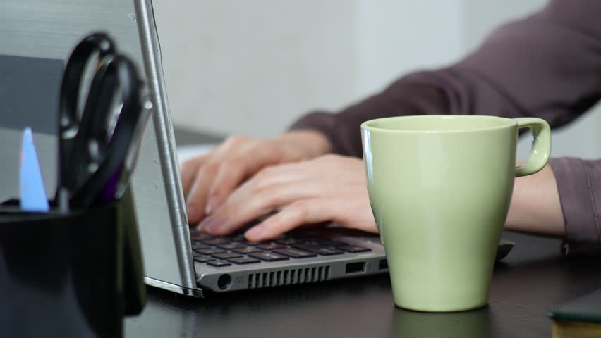woman poured tea onto laptop works Stock Footage Video (100% Royalty ...