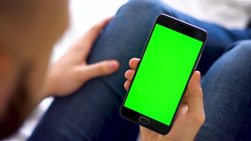 A Black Smartphone with Green Arkivvideomateriale (100 % royaltyfritt ...