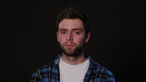 Young Man Immitating Toothache Against Black Stock Footage Video (100% ...