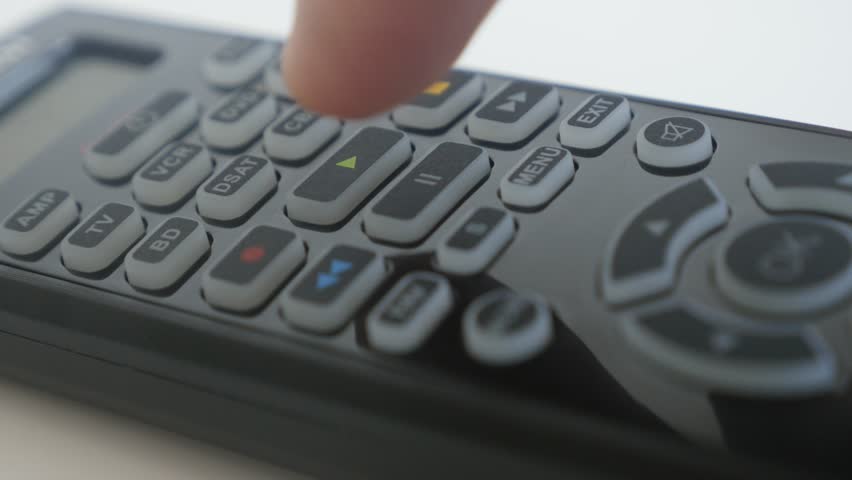 pressing play button on multimedia remote Stock Footage Video (100% ...