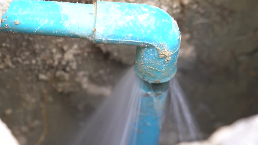 close leaking water blue pipe underground Stock Footage Video (100% ...