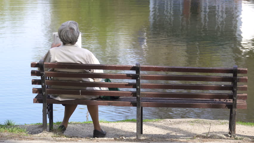 rear view elderly woman sitting on Stock Footage Video (100% Royalty ...
