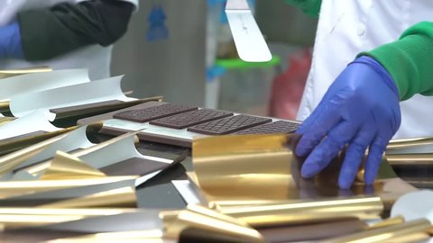 Packaging Chocolate Bars Wrappers By Hand Stock Footage Video (100% ...