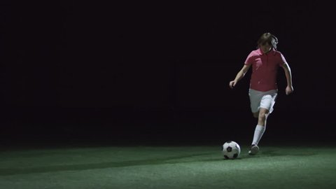 soccer player runs camera kicks ball Stock Footage Video (100% Royalty ...