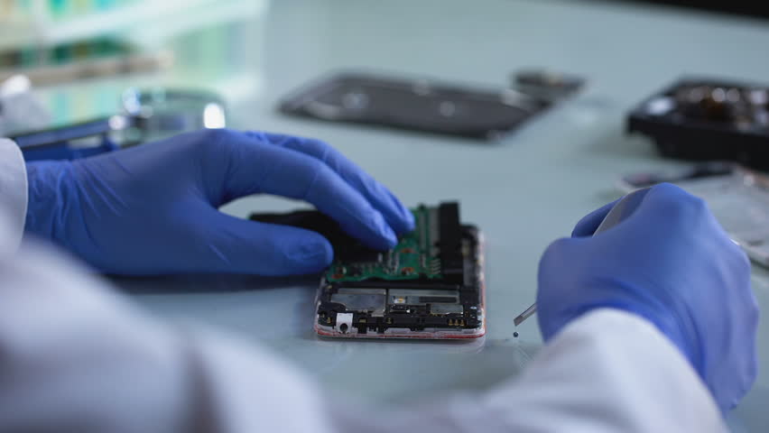 electronic hands assembling mobile phone connecting Stock Footage Video ...