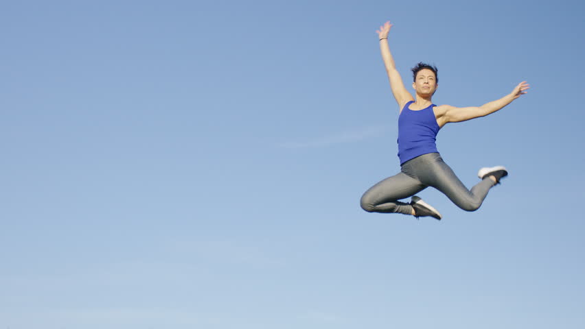 Young Woman Jumping up and Stock Footage Video (100% Royalty-free ...