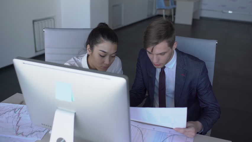 two young employees working sitting table Stock Footage Video (100% ...