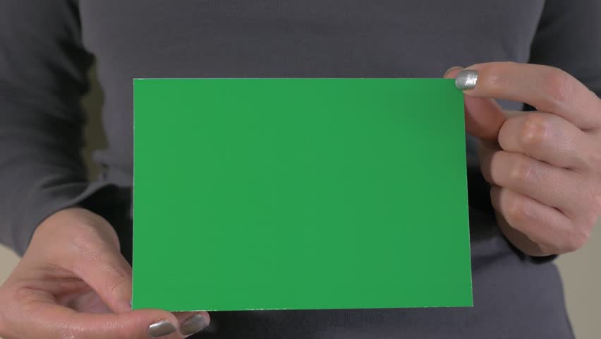 Woman Holding Green Paper for Stock Footage Video (100% Royalty-free ...