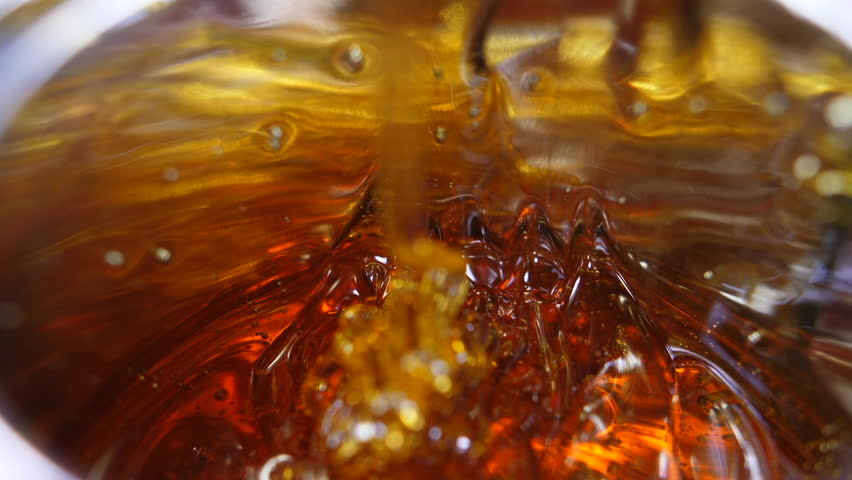 golden syrup pouring into metal container Stock Footage Video (100% ...