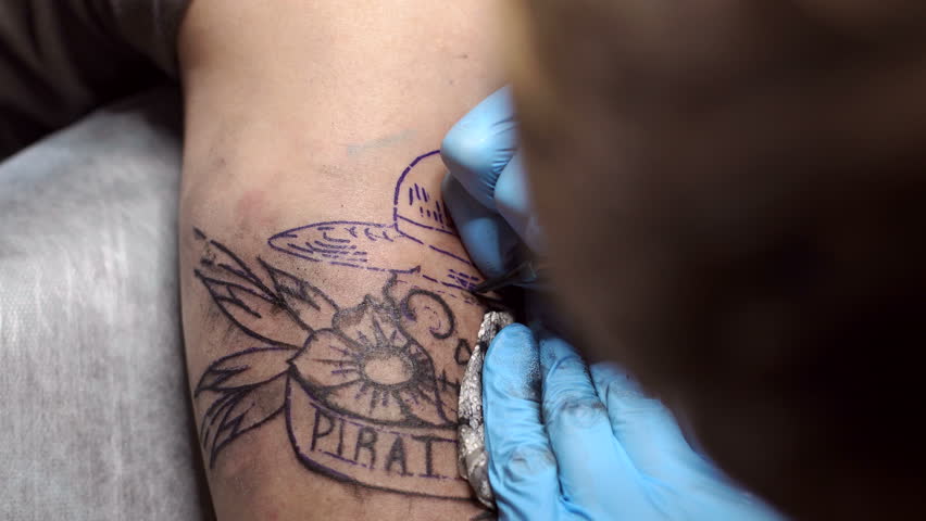 close-up tattoo artist makes on man's Stock Footage Video (100% Royalty ...