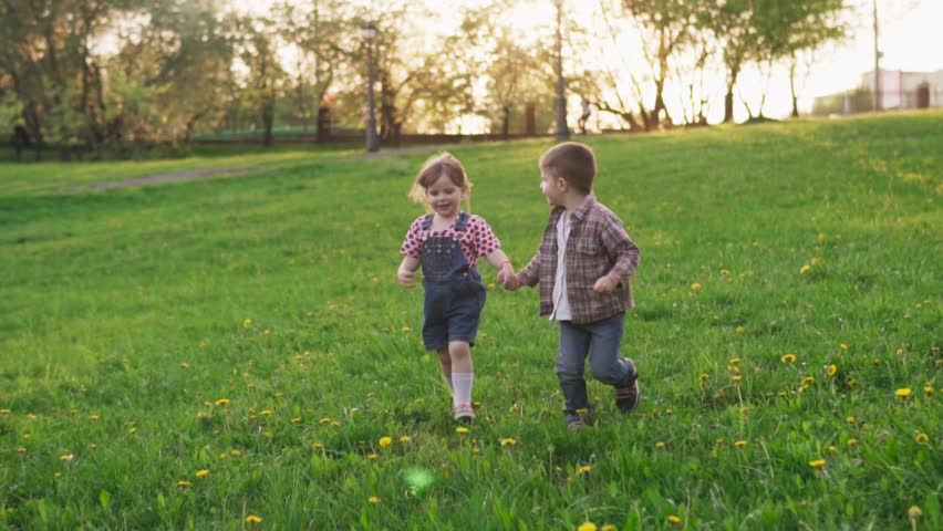 cute little children holding hands running Stock Footage Video (100% ...