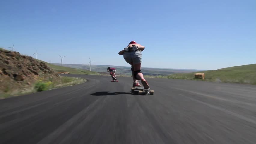 friends longboard skating on road Stock Footage Video (100% Royalty ...