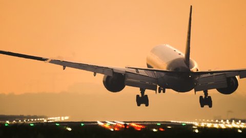 airplane landing runway sunset back view Stock Footage Video (100% ...
