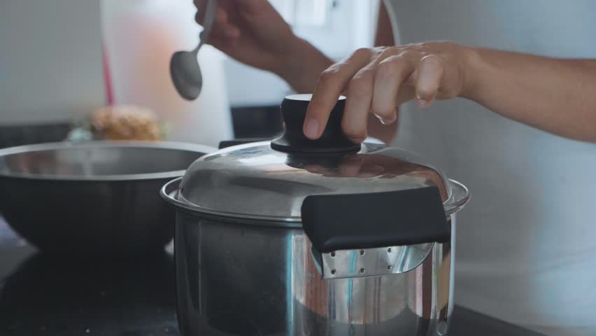 Hand with Spoon Stirring Boiling Stock Footage Video (100% Royalty-free ...