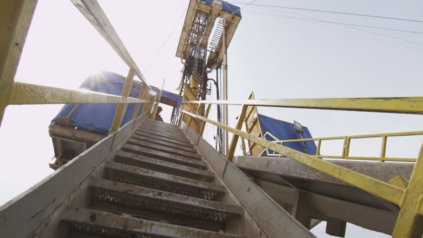 employee climbs down ladder drilling rig Stock Footage Video (100% ...