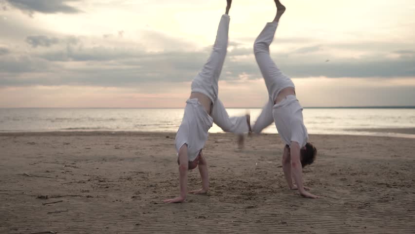 two men white clothes practicing capoeira Stock Footage Video (100% ...