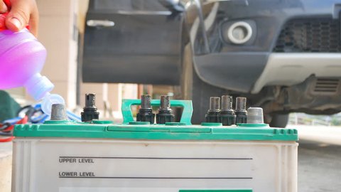 Man Refill Acid Water Car Battery Stock Footage Video (100% Royalty ...