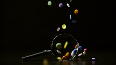 Falling Buttons Seen Through Magnifying Glass Stock Footage Video (100% ...