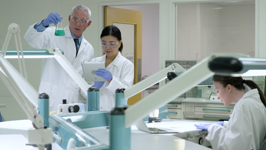 Scientists Swirling an Erlenmeyer Flask Stock Footage Video (100% ...