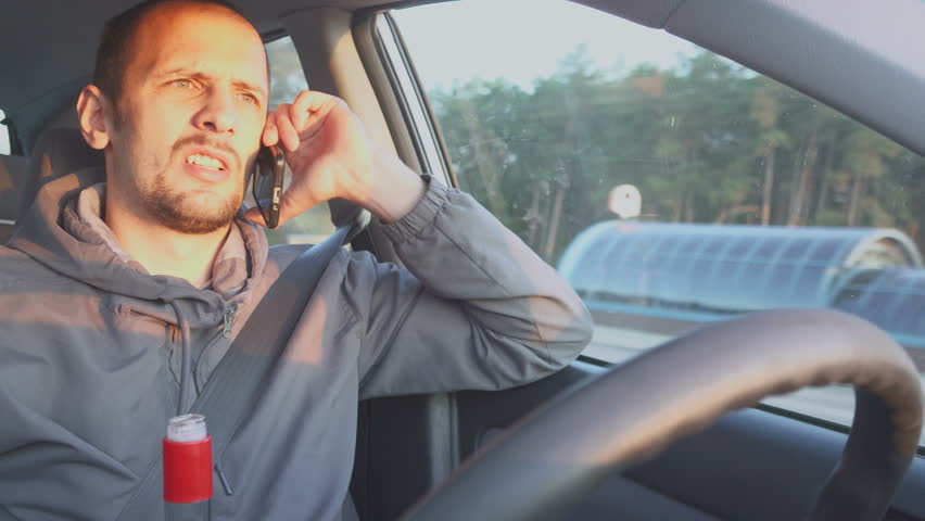 irresponsible man driving car speaking on Stock Footage Video (100% ...