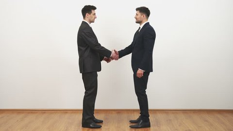 Two Men Handshake On White Wall Stock Footage Video (100% Royalty-free ...