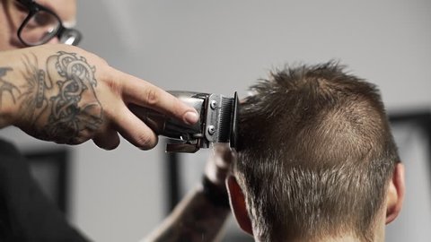 Tattoed Barber Makes Haircut Customer Barber Stock Footage Video (100% ...