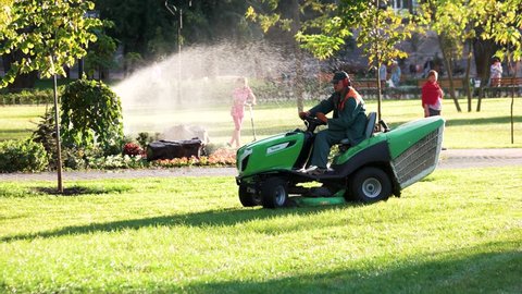 Man riding lawn mower Stock Video Footage - 4K and HD Video Clips ...