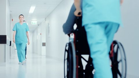 Following Shot Female Nurse Moving Patient Stock Footage Video (100% ...