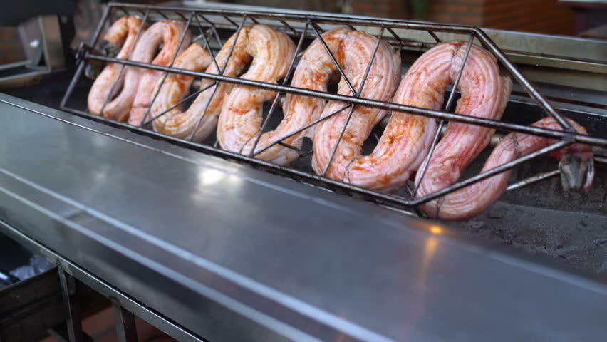 on spit barbecue fried snake men's Stock Footage Video (100% Royalty ...