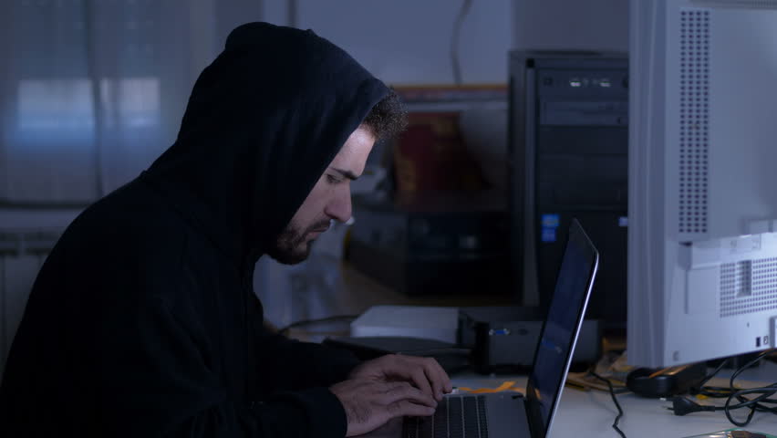 hacker hood cracking code using laptop Stock Footage Video (100% ...