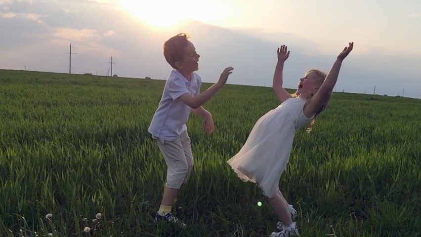 two happy children playing on meadow Stock Footage Video (100% Royalty ...