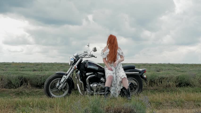 red-haired biker girl sitting on motorcycle Stock Footage Video (100% ...