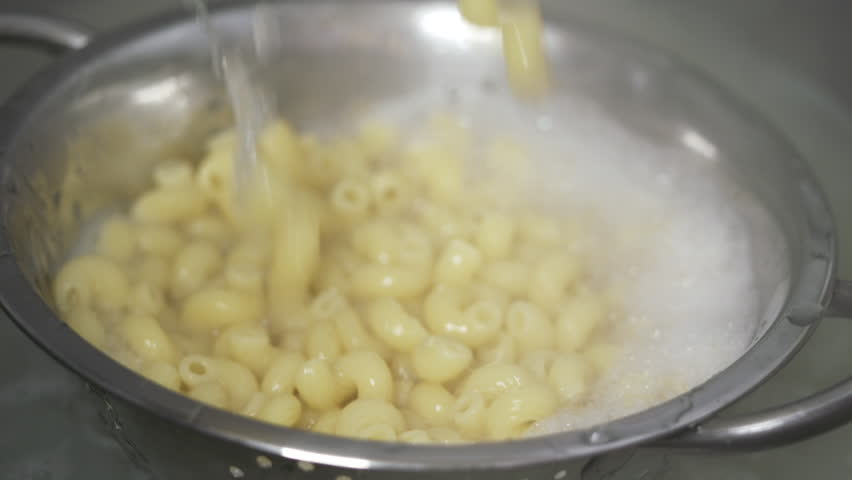 boiling pasta draining macaroni water through Stock Footage Video (100% ...