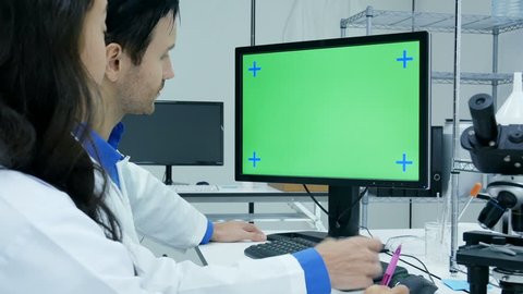 Scientists Chemists Using Computer Work Green Stock Footage Video (100% ...