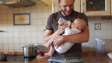 Father Giving Baby Bottle His Son Stock Footage Video (100% Royalty ...