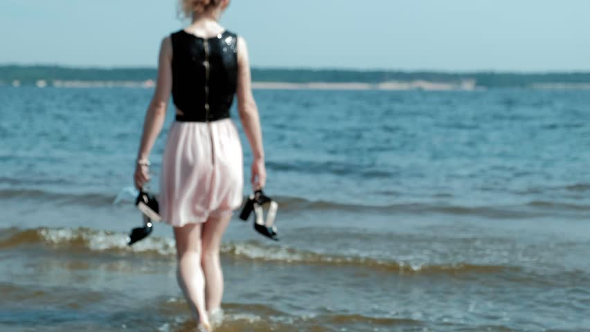 drunk woman walks into water on Stock Footage Video (100% Royalty-free ...