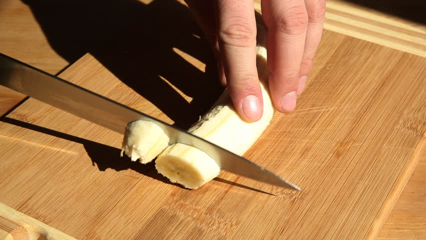 cutting banana knife on board Stock Footage Video (100% Royalty-free ...