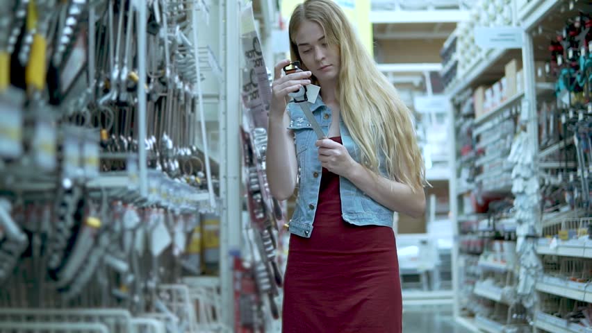 Slim Blonde Girl Is Choosing Stock Footage Video 100 Royalty Free 0964