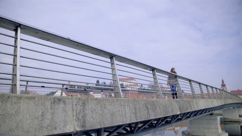 Woman Slowly Walking Over Bridge 4k Stock Footage Video (100% Royalty ...