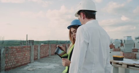 Two Young Engineers Walking Through Construction Stock Footage Video ...