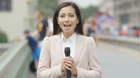 Young Asian Female News Reporter Reporting Stock Footage Video (100% ...